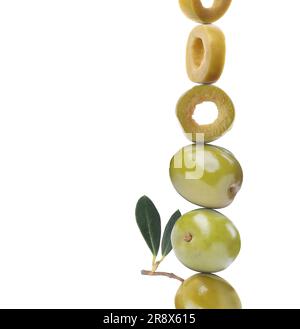 Cut and whole green olives with leaves on white background Stock Photo ...
