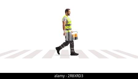 Road assistance mechanic walking and carrying a tool box isolated on ...