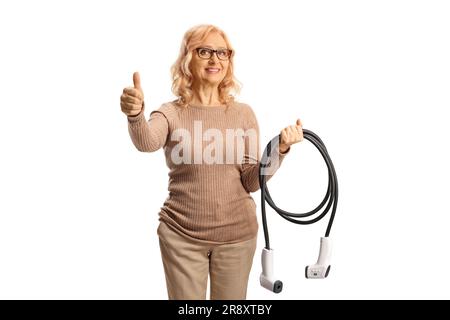 Woman holding cables for EV charging in front of electric cars isolated ...