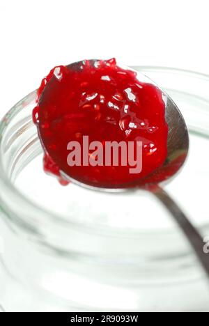 Jam on spoon Stock Photo - Alamy
