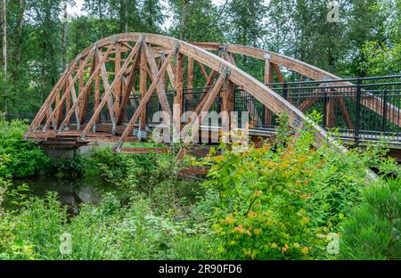 A pedestrian bridge over the Sammamish Riverr in Bothell, Washington ...