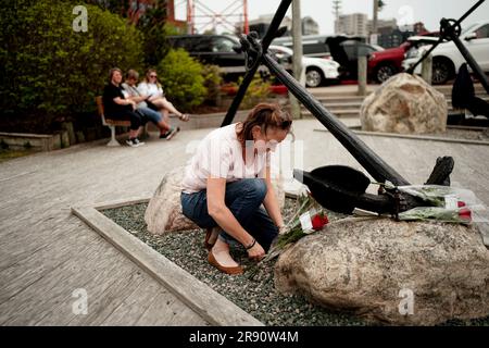 St John's resident Patsy Power places flowers at an anchor at King's ...