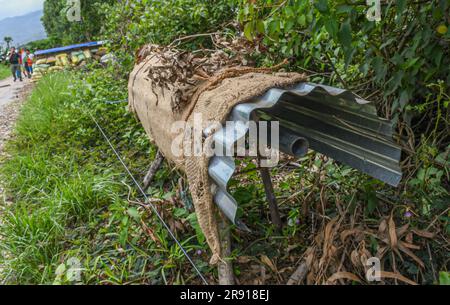 Displaced people from the Meitei community receive food at a relief ...