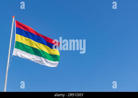 Colorful flag of Terschelling in front fo blue sky Friesland province ...