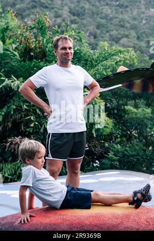 Happiness with dad. Father's Day. Raising son. Man smiling standing ...