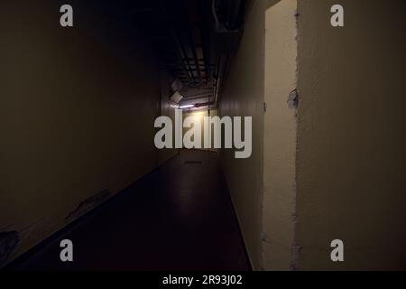 Dark and narrow corridor with neon lights Stock Photo - Alamy