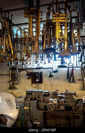Damaged old brass trumpets waiting for repair Stock Photo - Alamy