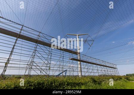 The scaffold tower structure used to hang a safety net over a road ...