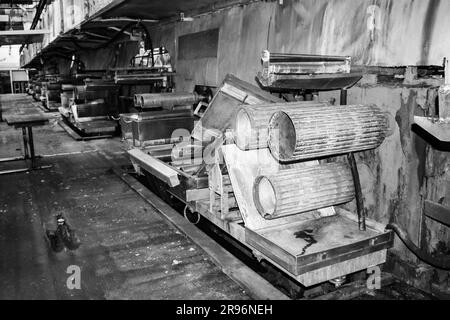 Large metal rollers rolls with teeth of the gears of the production ...