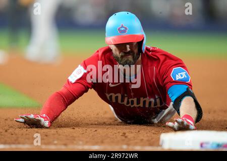 Miami Marlins' Jon Berti slides behind Tampa Bay Rays catcher Christian ...