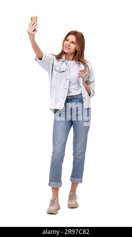 Beautiful woman taking selfie on white background Stock Photo - Alamy