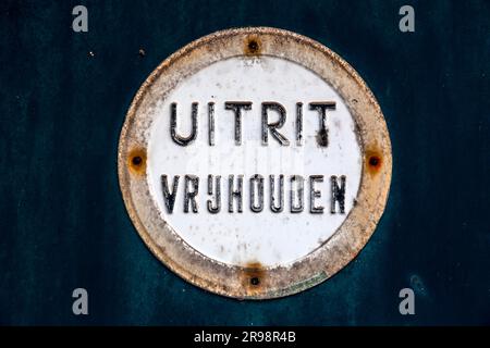 Dutch garage door warning sign. The Dutch text translates as Exit, Keep ...
