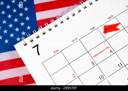4 th July calendar with part of an American flag on white background ...
