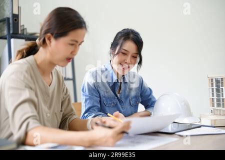 Concept of engineering consulting, Two female engineers discussing ...