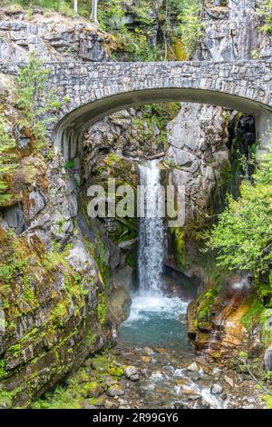 A view of a waterfall with a highway above on Mount Rainier in ...