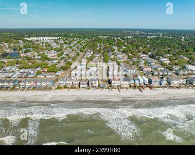 An aerial view of stunning view of beachfront condos situated along an ...