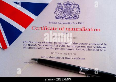 Certificate of registration as a British Citizen and pen on top ...