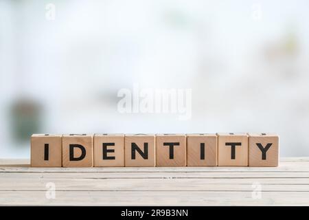 Identity sign made of cubes on wooden table Stock Photo - Alamy