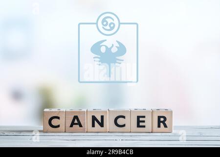 Cancer star sign on a wooden table Stock Photo - Alamy