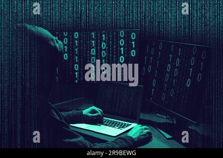 Cyber attack. Anonymous hacker working with laptop and monitors on dark blue background. Binary ...