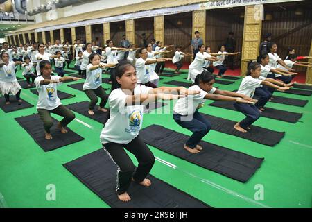 Government officials and people perform yoga during an International ...