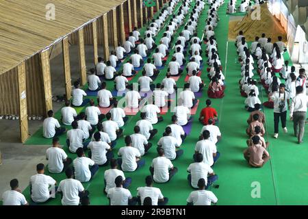 Government officials and people perform yoga during an International ...