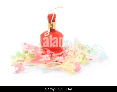 Colorful streamers with red party cracker isolated on white, top view ...