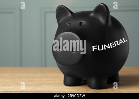 Money for funeral expenses. Black piggy bank and dollar banknotes on ...