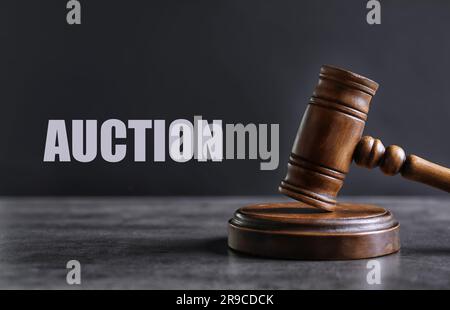 Auction. Wooden gavel on grey textured table, banner design Stock Photo ...