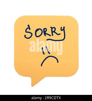 Apology. Sticky note with word Sorry and drawn sad face pinned on white ...