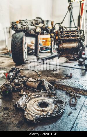disassemble the engine from the car in the car workshop Stock Photo - Alamy