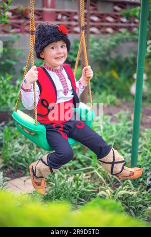 Bulgarian boy in ethnic folklore costume with traditional embroidery on ...