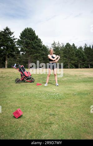 Teenager playing Golf Stock Photo - Alamy