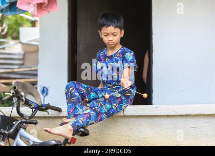 Children playing Lato Lato in Philippines, the trending toy that craze ...
