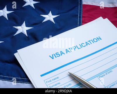 Immigration to USA. Visa application form and pen on flag, flat lay ...