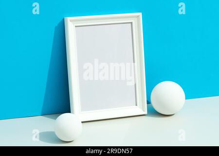 Blank picture frame mockup on green wall. Emerald living room design ...