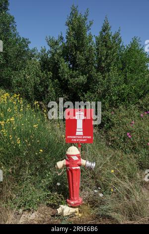 Red painted fire hydrant, Kefalonia,Greece Stock Photo - Alamy