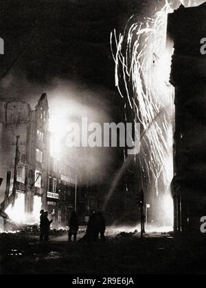 Firemen tackling fires caused by firebombs which fell in Eastcheap on ...