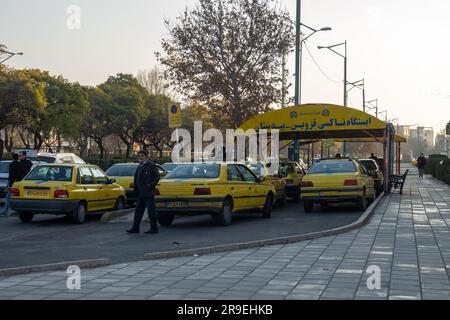 Qazvin, Iran- December 18, 2022: Night city streets. Garbage man ...