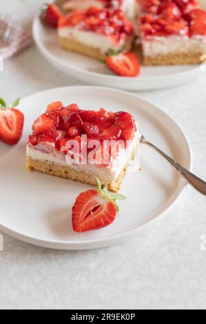 Slice of cake with cream on top Stock Photo - Alamy