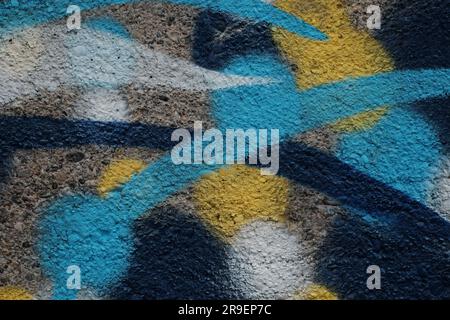 Urban expressions come alive on a graffiti-covered wall: A vibrant mix ...