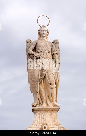 Statue of Saint Raphael in the middle of the Roman Bridge, Puente ...