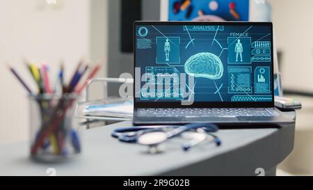 Empty reception counter with laptop running neural system tomography ...