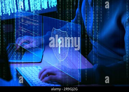 Hacker near computers in dark room and digital symbols on background ...