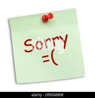 Apology. Sticky note with word Sorry and drawn sad face on white ...