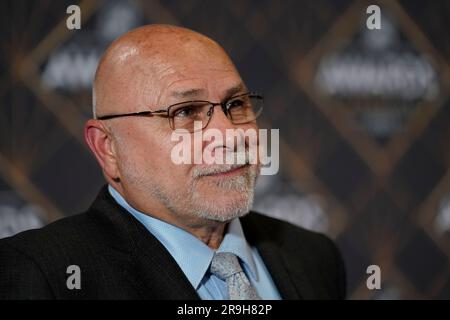 Nashville Predators hockey general manager Barry Trotz walks the red ...