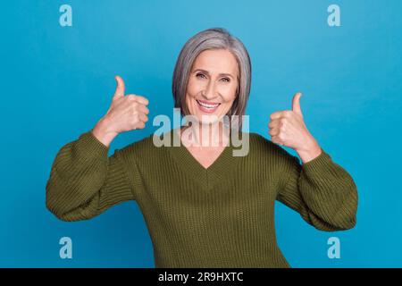 Photo of charming lady raise thumb finger up express agreement wear ...