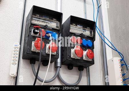 Wall mounted industrial electrical power socket and fuse box with plugs ...