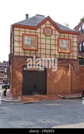 Green lattice and red window surrounds float on the stucco walls of ...