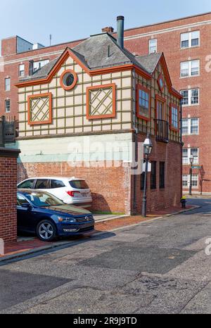 Green lattice and red window surrounds float on the stucco walls of ...